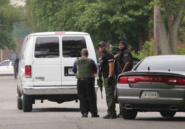 Gary officer killed; three people in custody