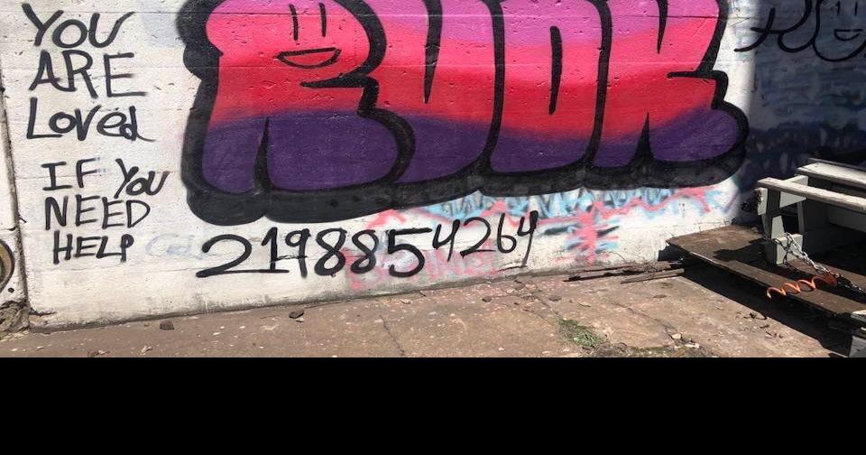 Graffiti artist asks people if they're okay, gives number of mental ...