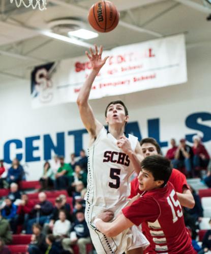 South Central's Max Clemons drives on Crown Point's Sasha Stefanovic