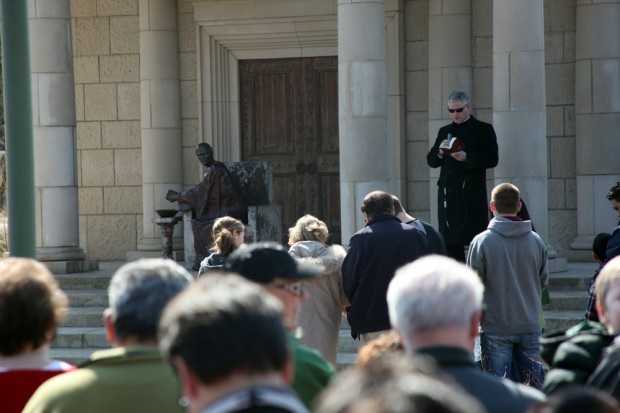 Father Rocky leads Good Friday service in St. John