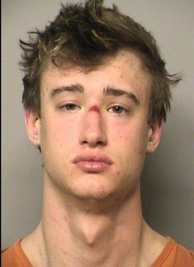 Man arrested after found hiding under hotel bed