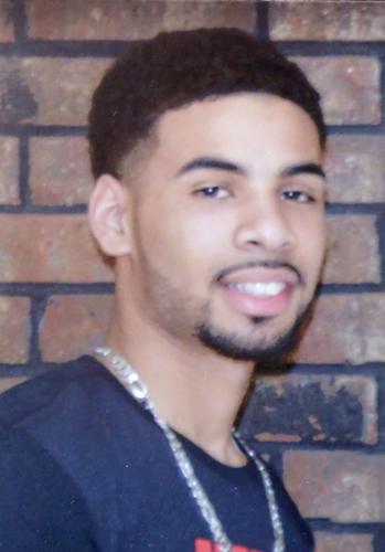 Family honors slain son with holiday food voucher giveaway