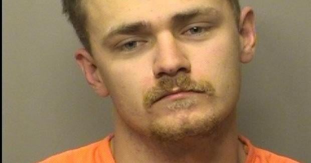 Inmate charged with spitting in guard's face