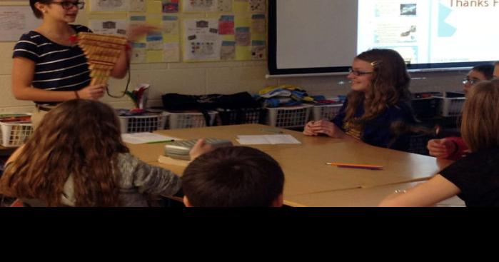 Student shares artifacts with sixth graders
