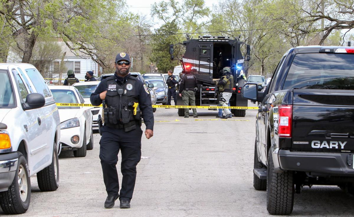 Woman charged in shooting, standoff with Gary police