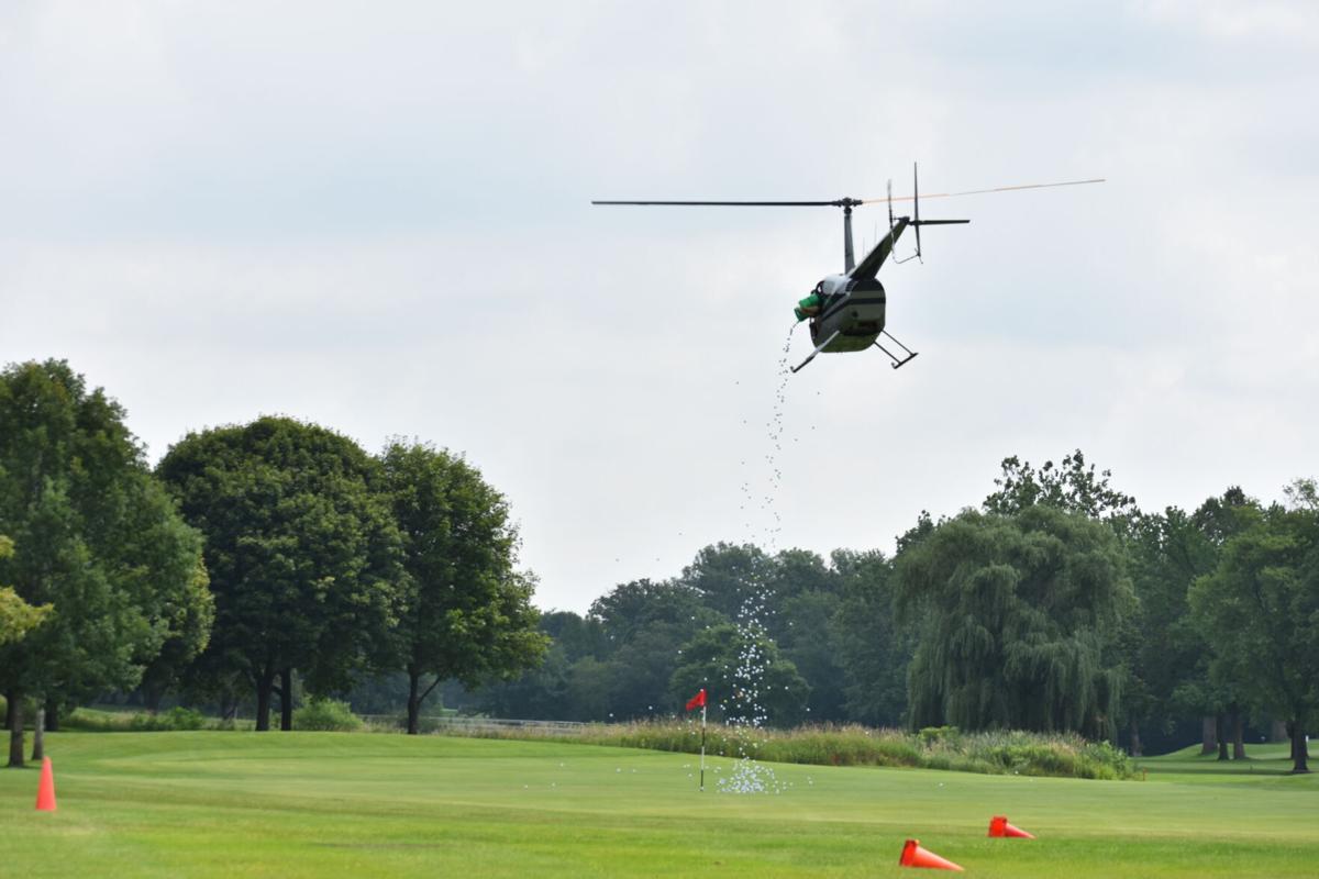 BNI hosts helicopter ball drop to benefit school