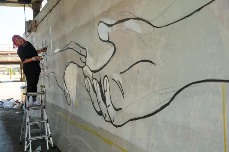 International artist brightens downtown Gary with mural