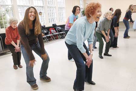 Seniors, young and old, share dance steps