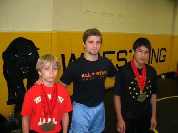 Former four-time state champ returns to coach hometown club