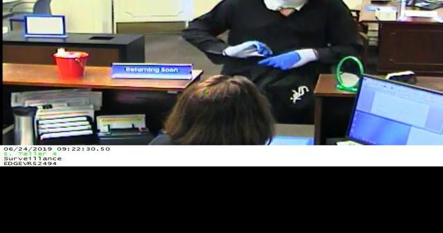 Images of masked bank robber released by police