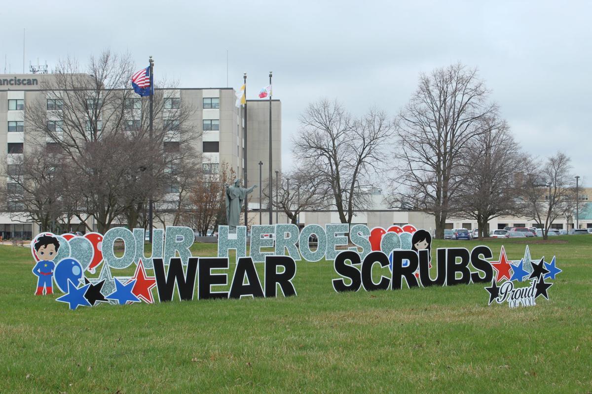 Sign salutes the heroes who wear scrubs