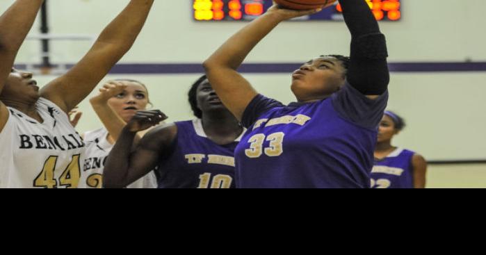 T.F. North's Michelle Pruitt puts back an offensive rebound against Oak ...