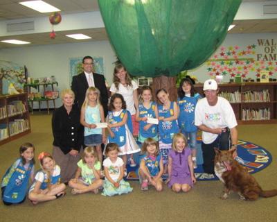 Daisy troop makes donations