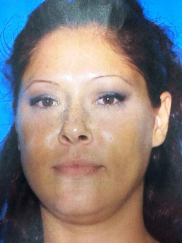 Photo released of woman wanted in connection with murder case