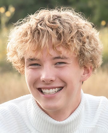 Almlie wins conference title at No. 1 singles | Sports | osceolasun.com