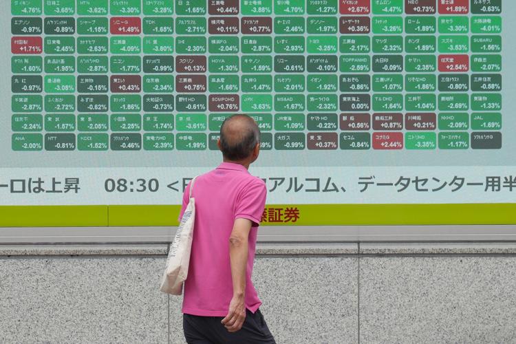 A drop for Alphabet helps slow Wall Street's record-breaking rally ...