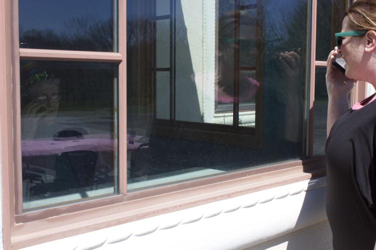 Family gathers outside of White Oaks Estates to celebrate relatives ...