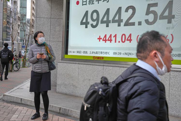 World shares advance after Japan raises its key interest rate to its ...