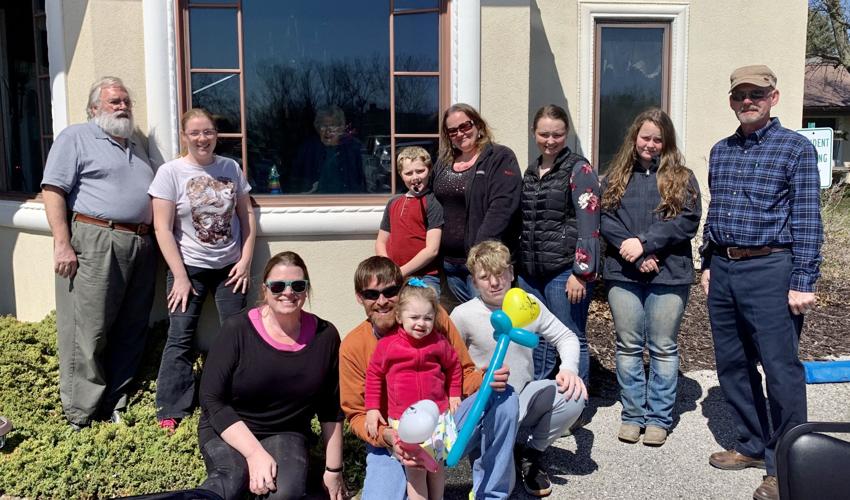 Family gathers outside of White Oaks Estates to celebrate relatives ...