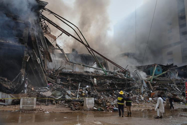 Death toll in Karachi shopping plaza fire rises to 11 as search continues for about 60 missing ...