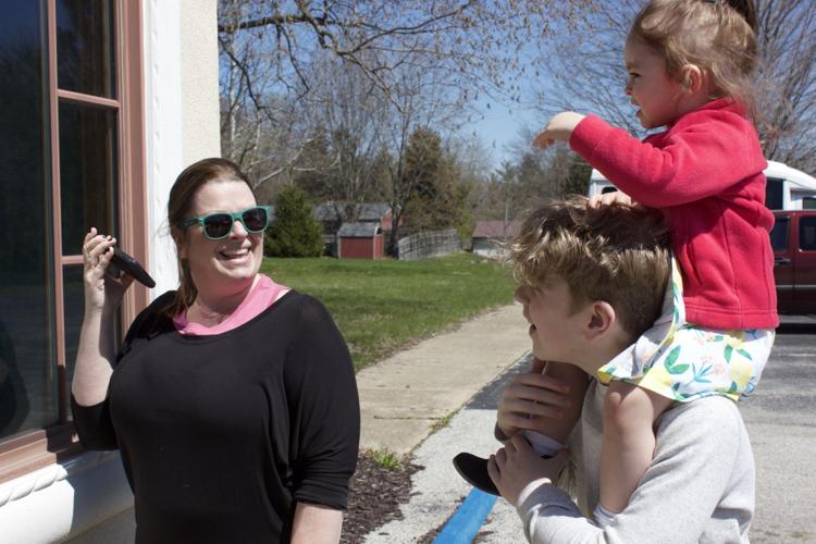 Family gathers outside of White Oaks Estates to celebrate relatives ...