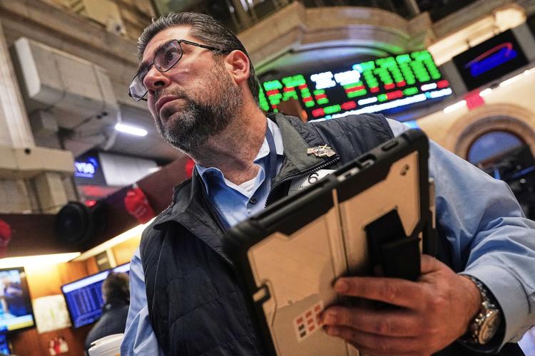 Stocks edge a bit below their latest records on Wall Street | National ...