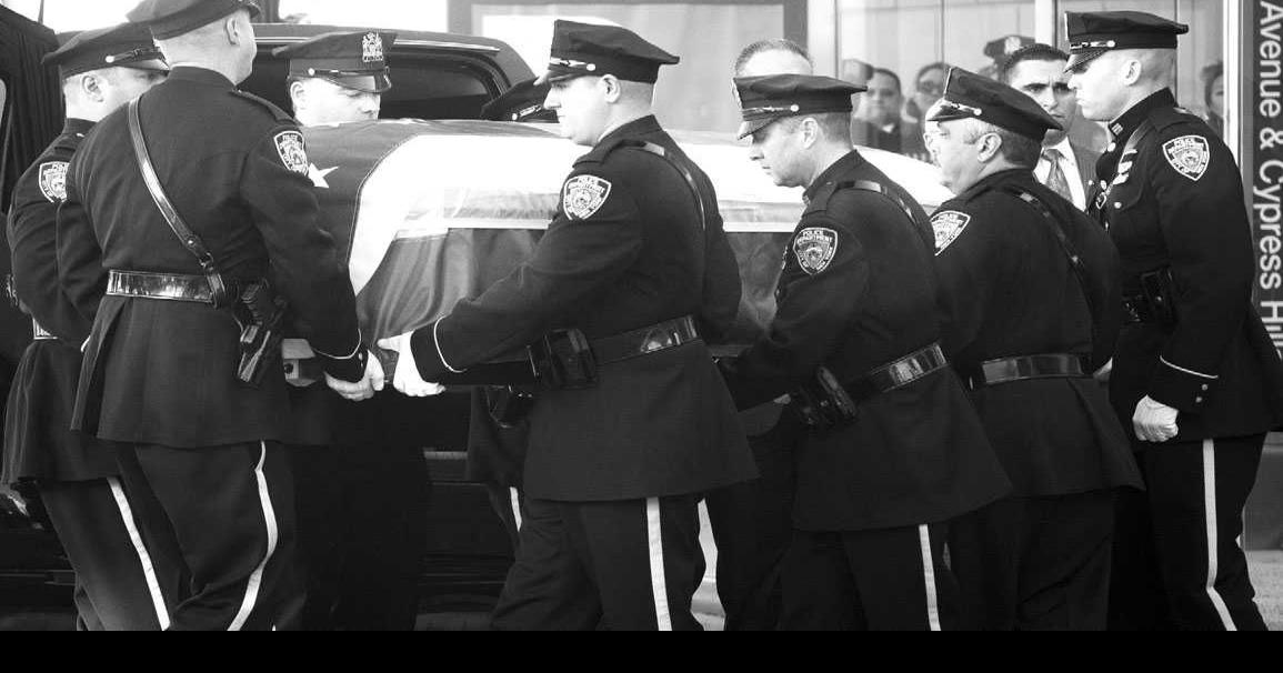 Fellow officers salute NY cop's flag-draped casket | Local ...