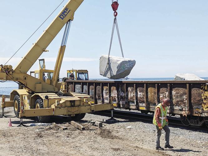 Breakwall repair project begins at Port of Oswego with granite block deliveries | News ...