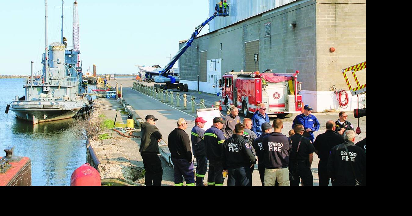 Groups collaborate for firefighting exercises aboard historic tug ...