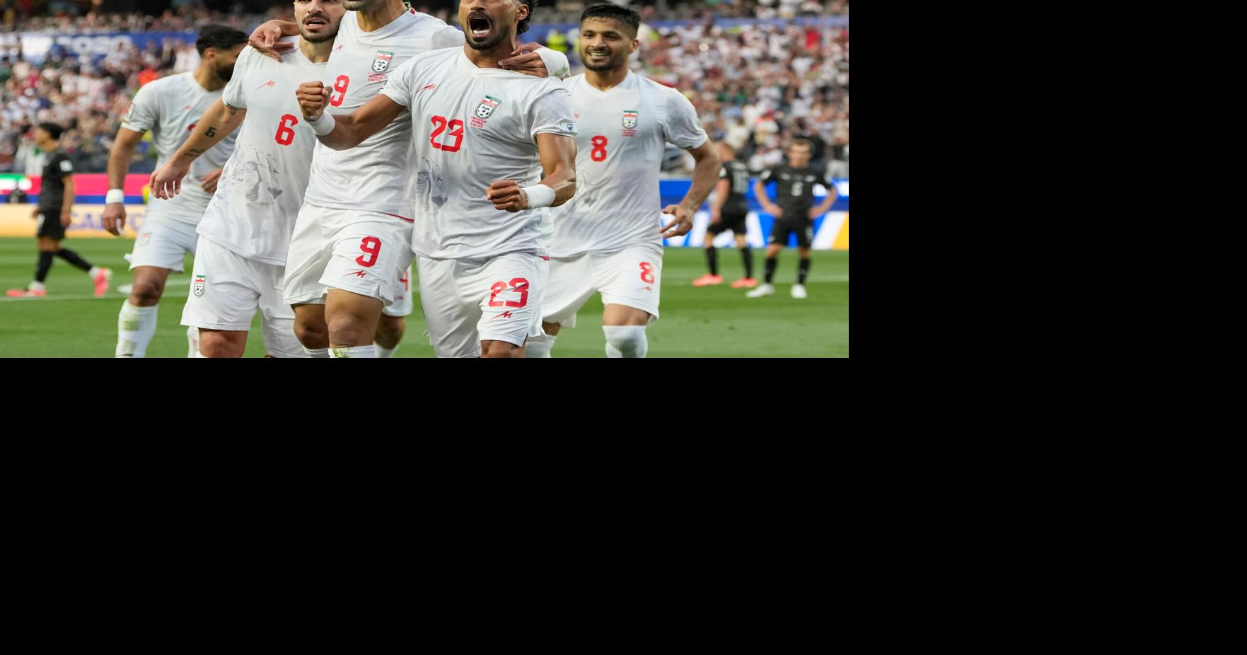 Iran opens its politically charged World Cup by playing to a 2-2 draw ...