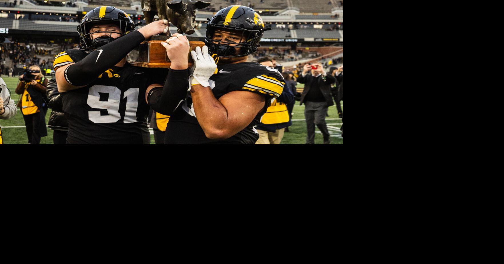 College football: Hawkeyes boost Floyd, expectations with rivalry win ...