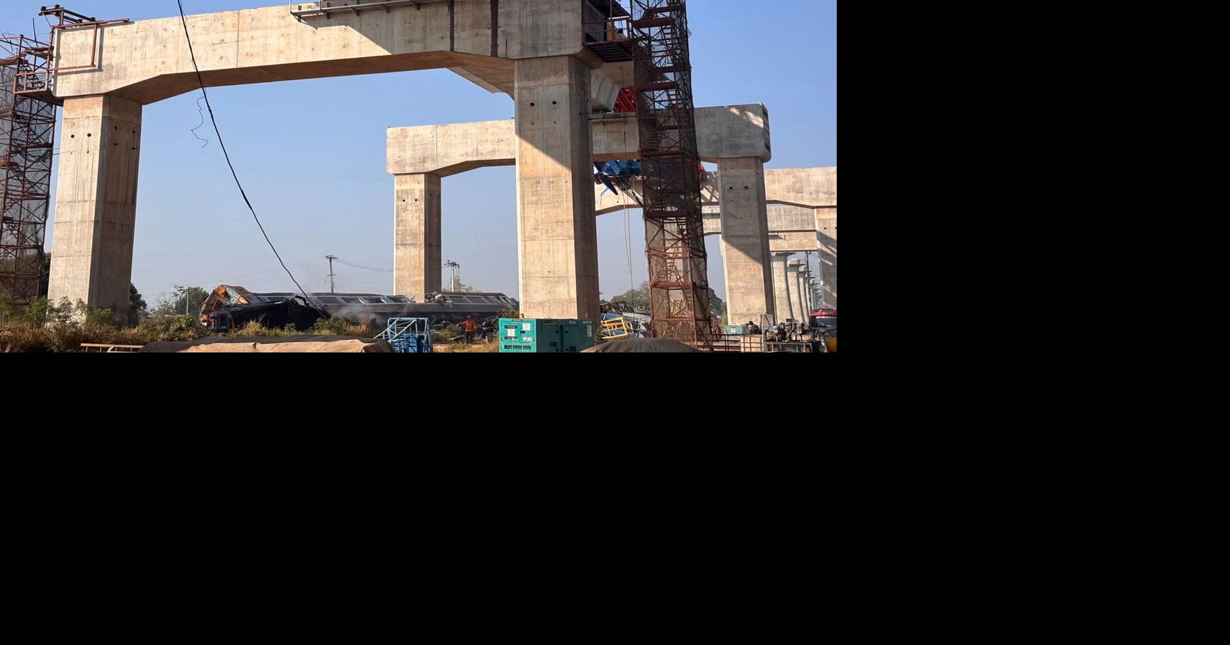 A construction crane falls onto a moving train in Thailand, killing at ...