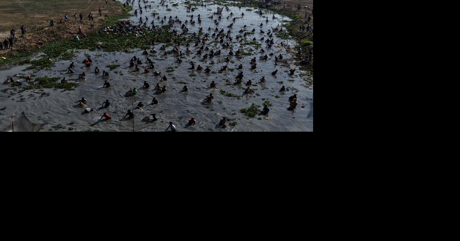 Photos of a community catch in an Indian fishing village marking the ...