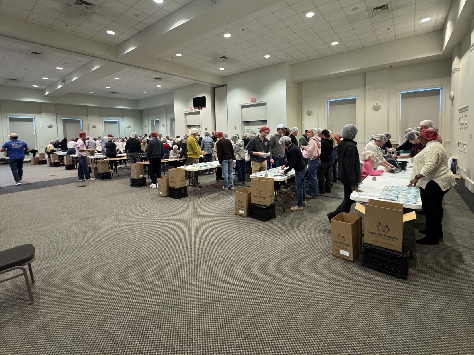 Rotary volunteers pack over 26K meals to fight hunger | News ...