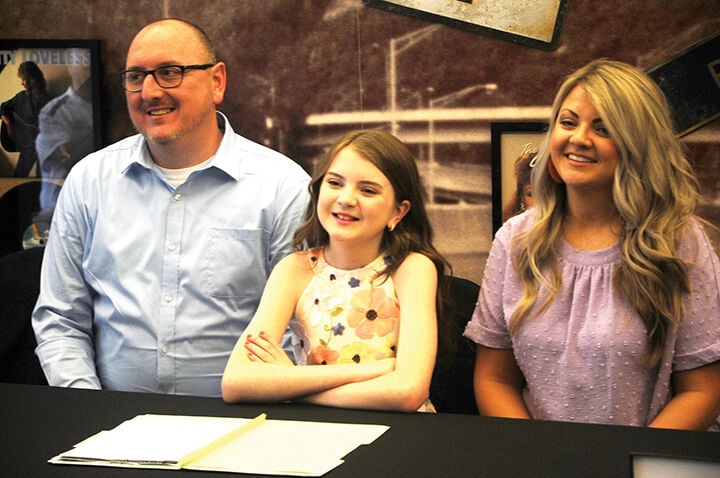 Singing and signing: Local artist signs record contract | News ...