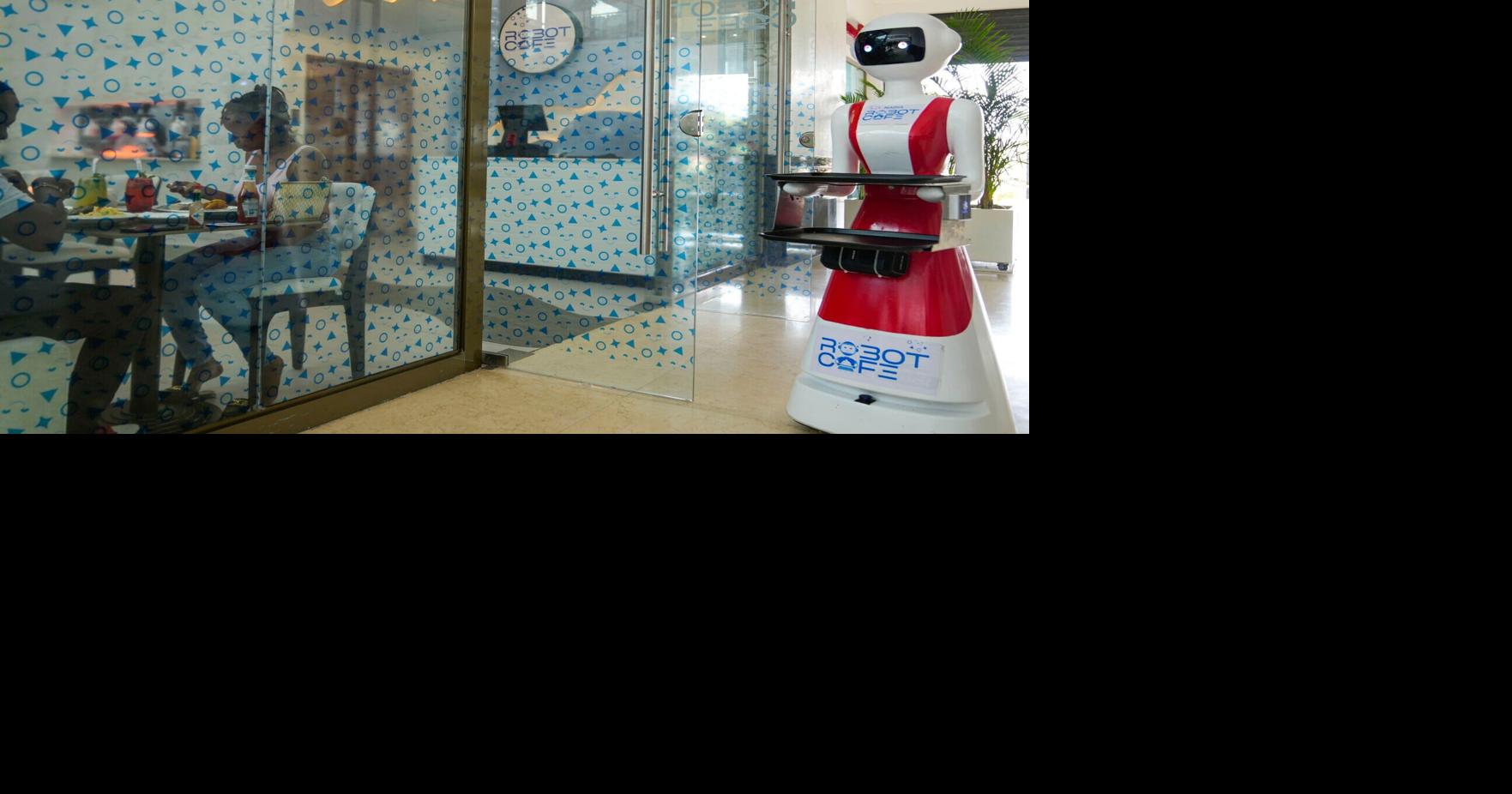 Robot waiters turn heads in Kenya cafe
