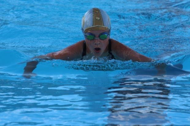 Swim team finishes regular season with two dual wins