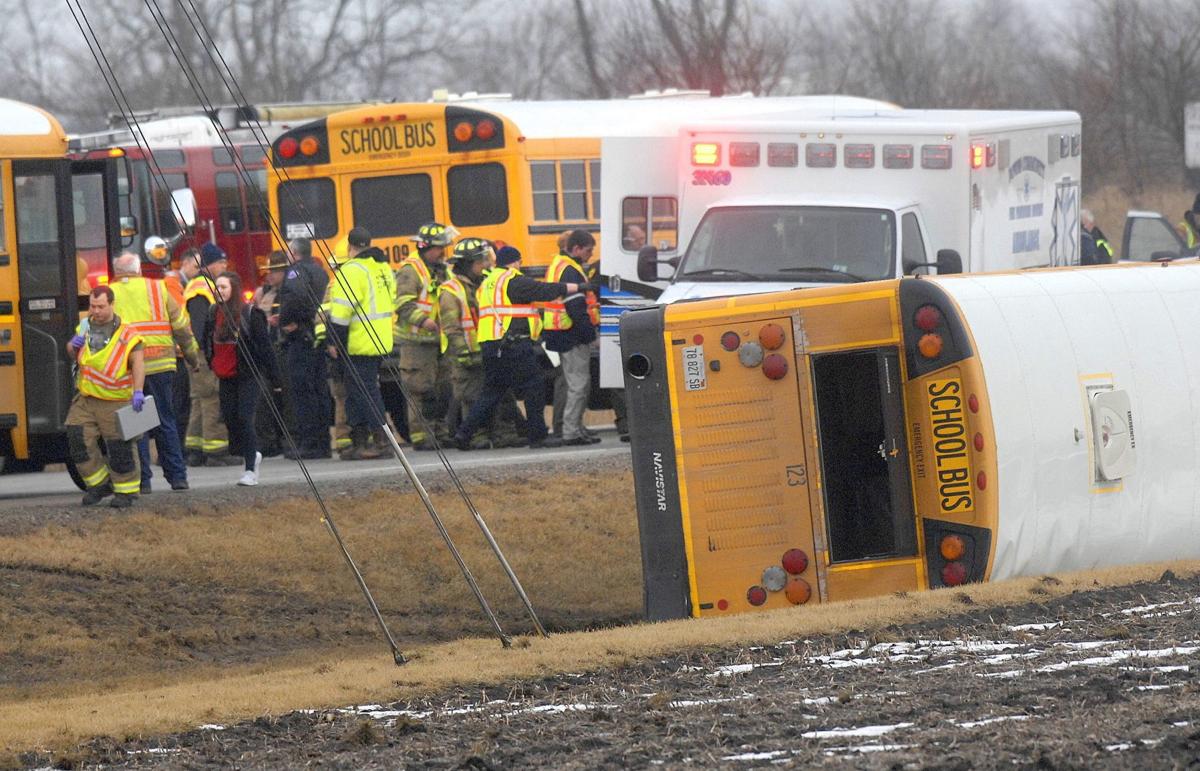 Photos: School bus rollover injures students, drivers on U.S. 150