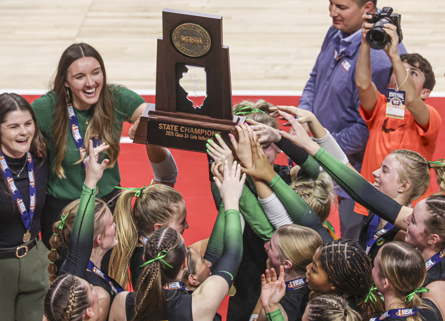 STATE CHAMPIONS: University High volleyball rules over Class 3A