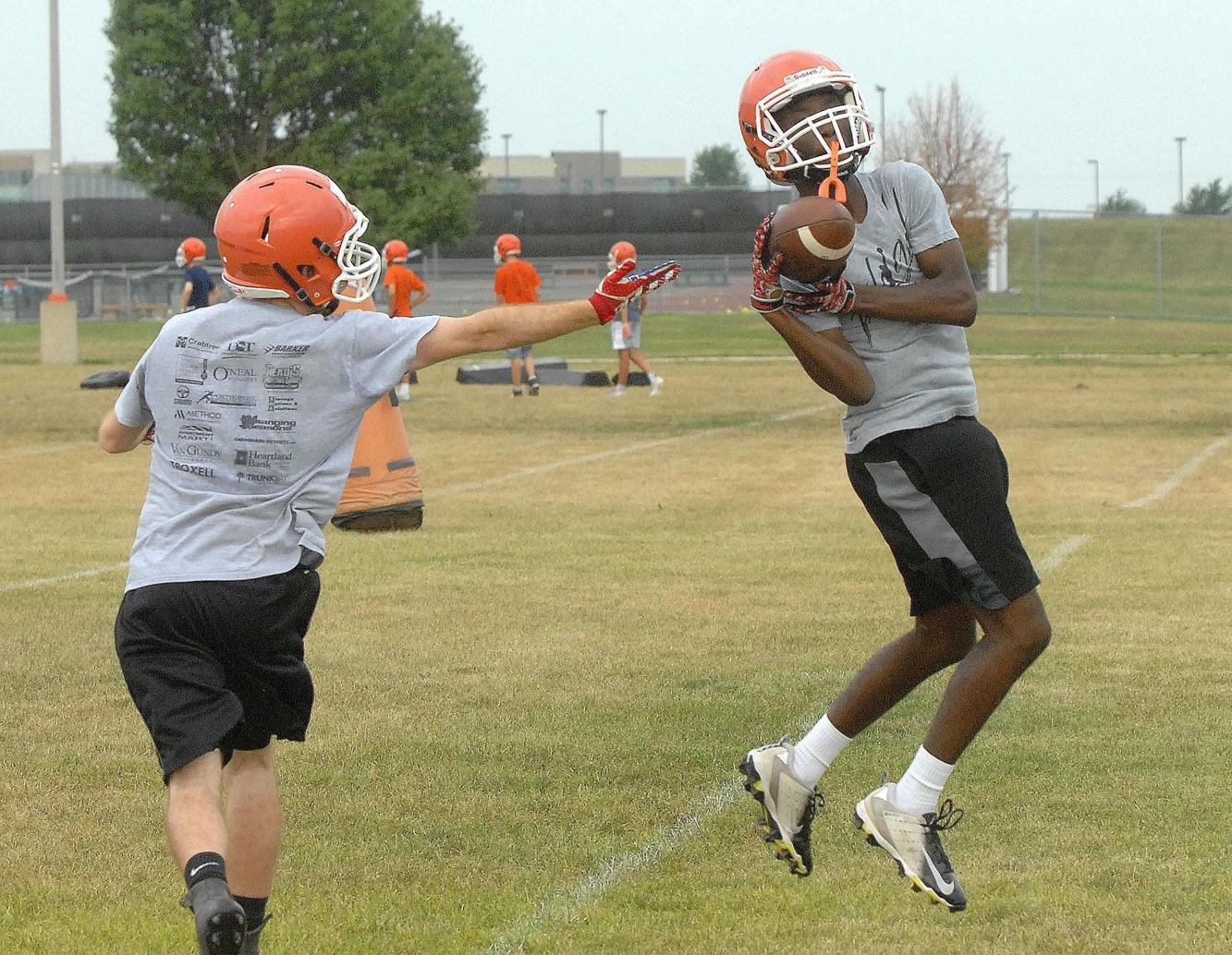 Photos: Normal Community football team runs first-day drills
