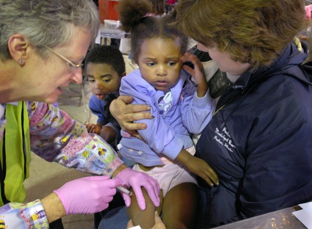 Crying children, happy parents: Long lines for H1N1 vaccine clinic