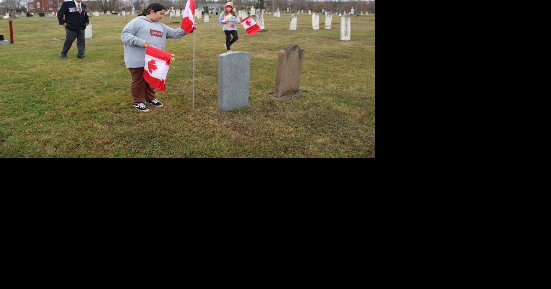 Tradition continues as students place Canadian flags at the graves of ...