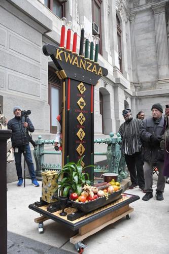 Philadelphia lights first official kinara for start of Kwanzaa ...