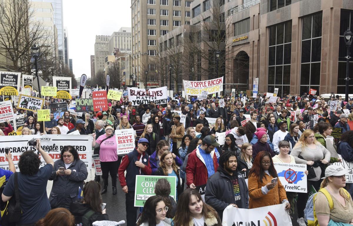Despite rain, thousands rally at annual social justice march | News ...