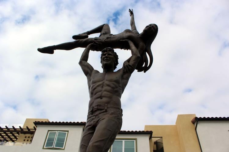 Soaring Statues: Tandem Surfers Immortalized at Watermen’s Plaza ...