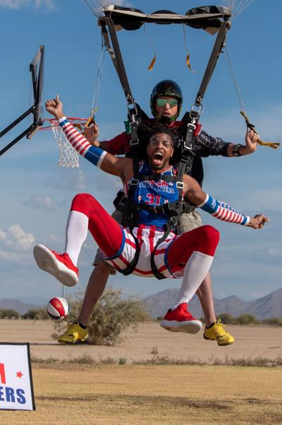 Video: Harlem Globetrotter makes skydiving slam dunk over Eloy ...