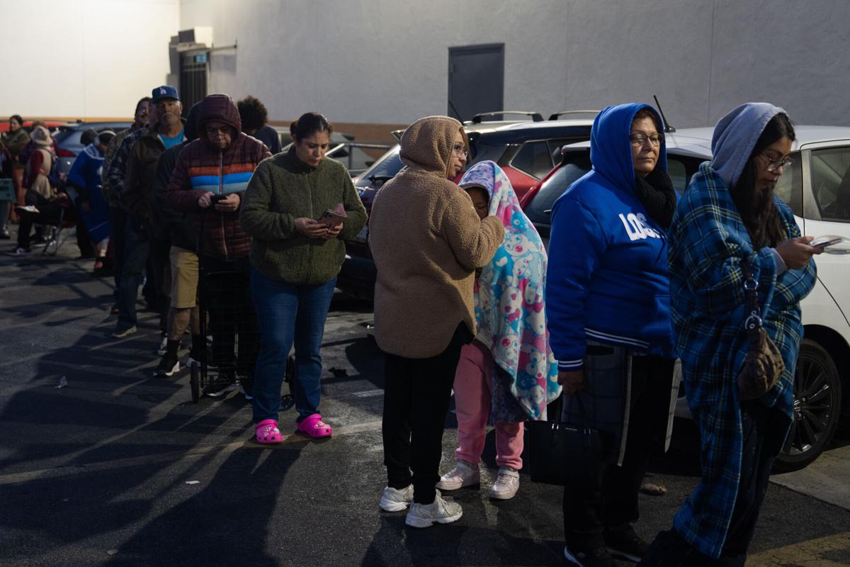 Families wait in line for hours to buy masa for Christmas tamales at ...