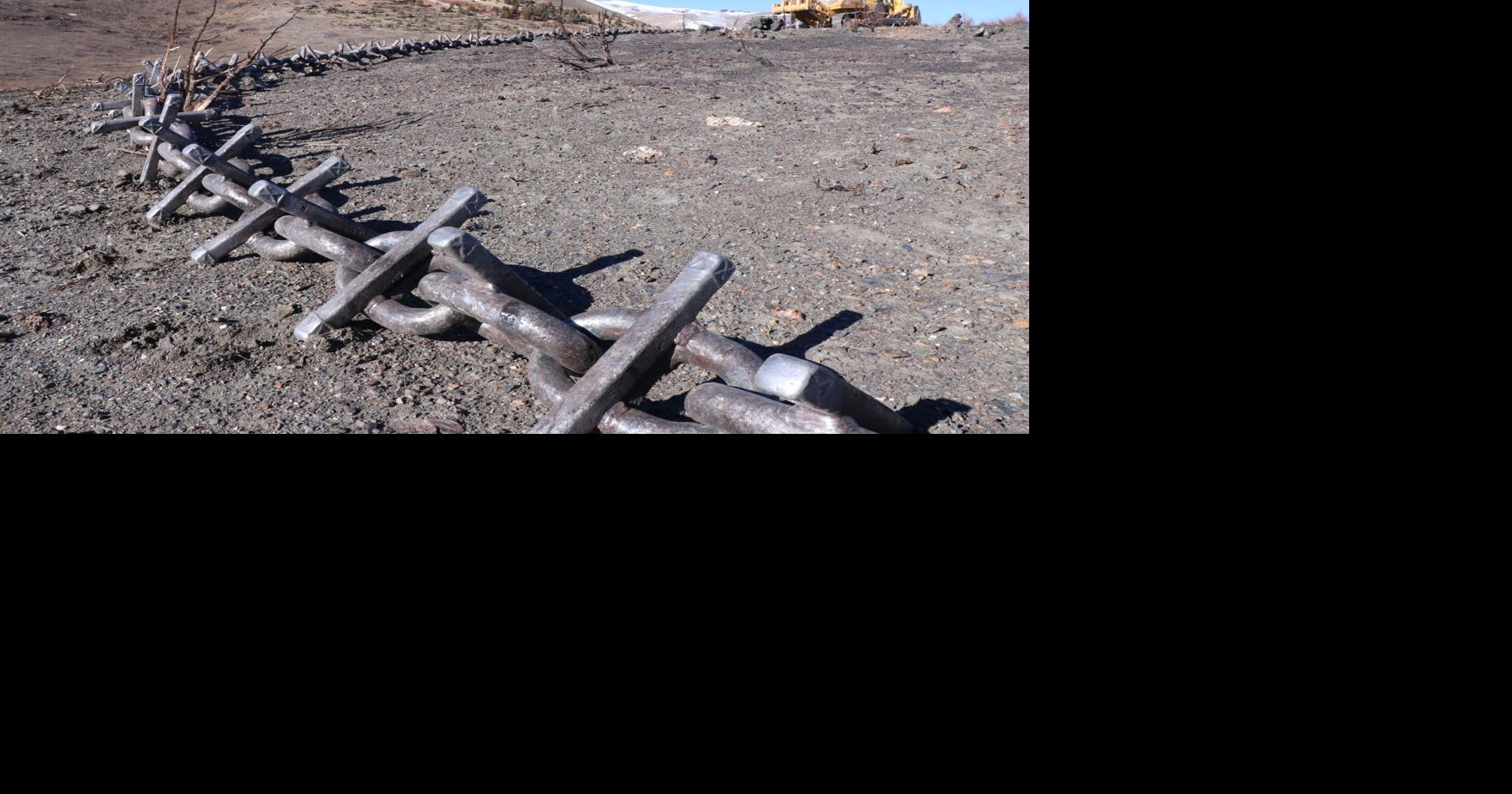 The 'chaining' gang: Massive chain clears areas for habitat restoration ...