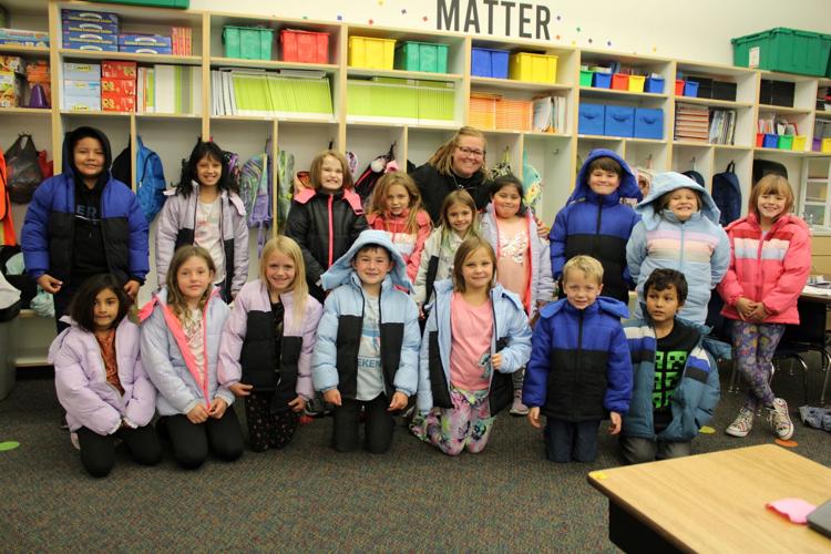 Wrapped up and warm: A.H. Bush students receive 450 new, winter coats ...