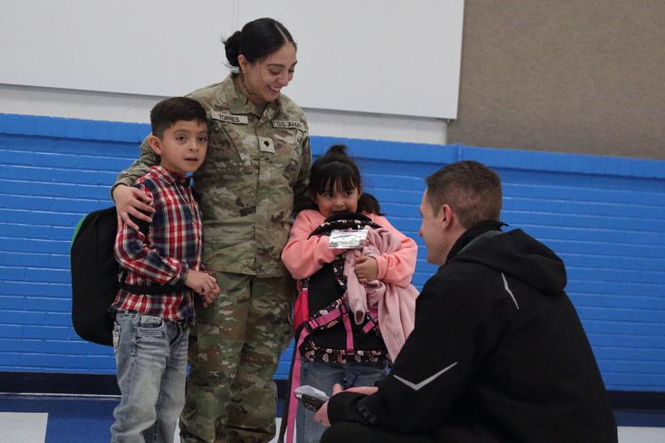 Returning military member surprises her children at school assembly ...